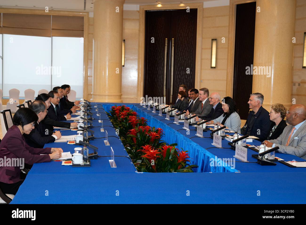 Beijing Mayor Yin Yong, fourth from left, speaks with U.S. Rep. Adam ...