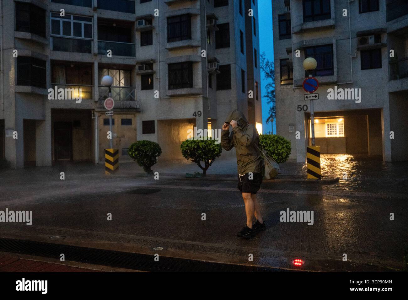 Hong Kong During Typhoon Ragasa A man reacting to strong winds at Heng ...
