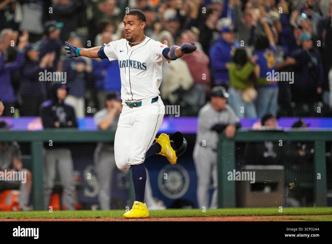 Seattle Mariners' Julio Rodriguez scores the go-ahead run off a three ...
