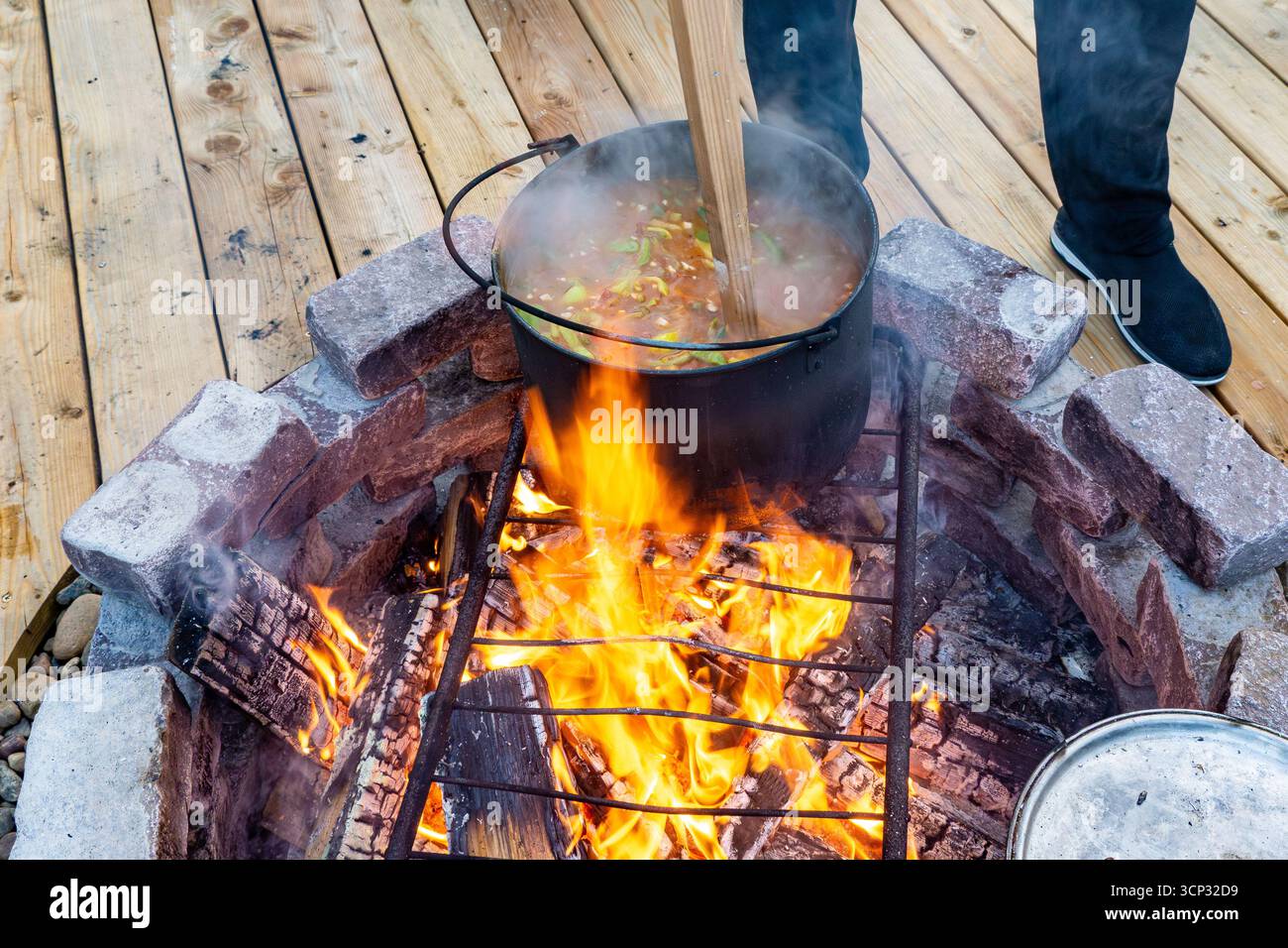 Wooden spoon stirs steaming hi-res stock photography and images - Alamy