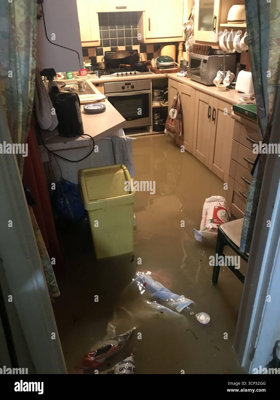 Inside a home kitchen during a flood under 6 inches of water after the ...