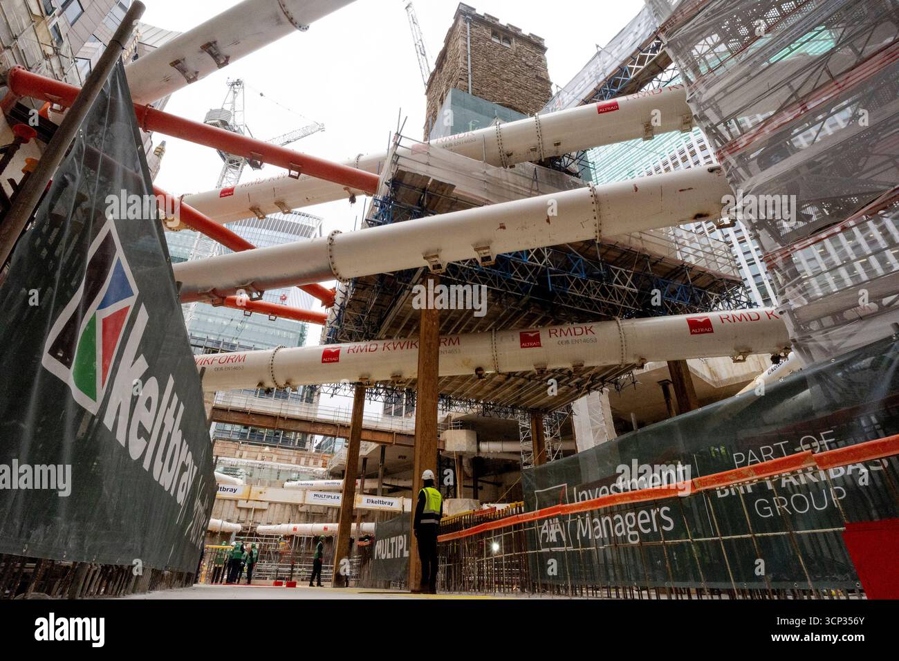 People stand beneath the 700-year-old tower of All Hallows Staining ...