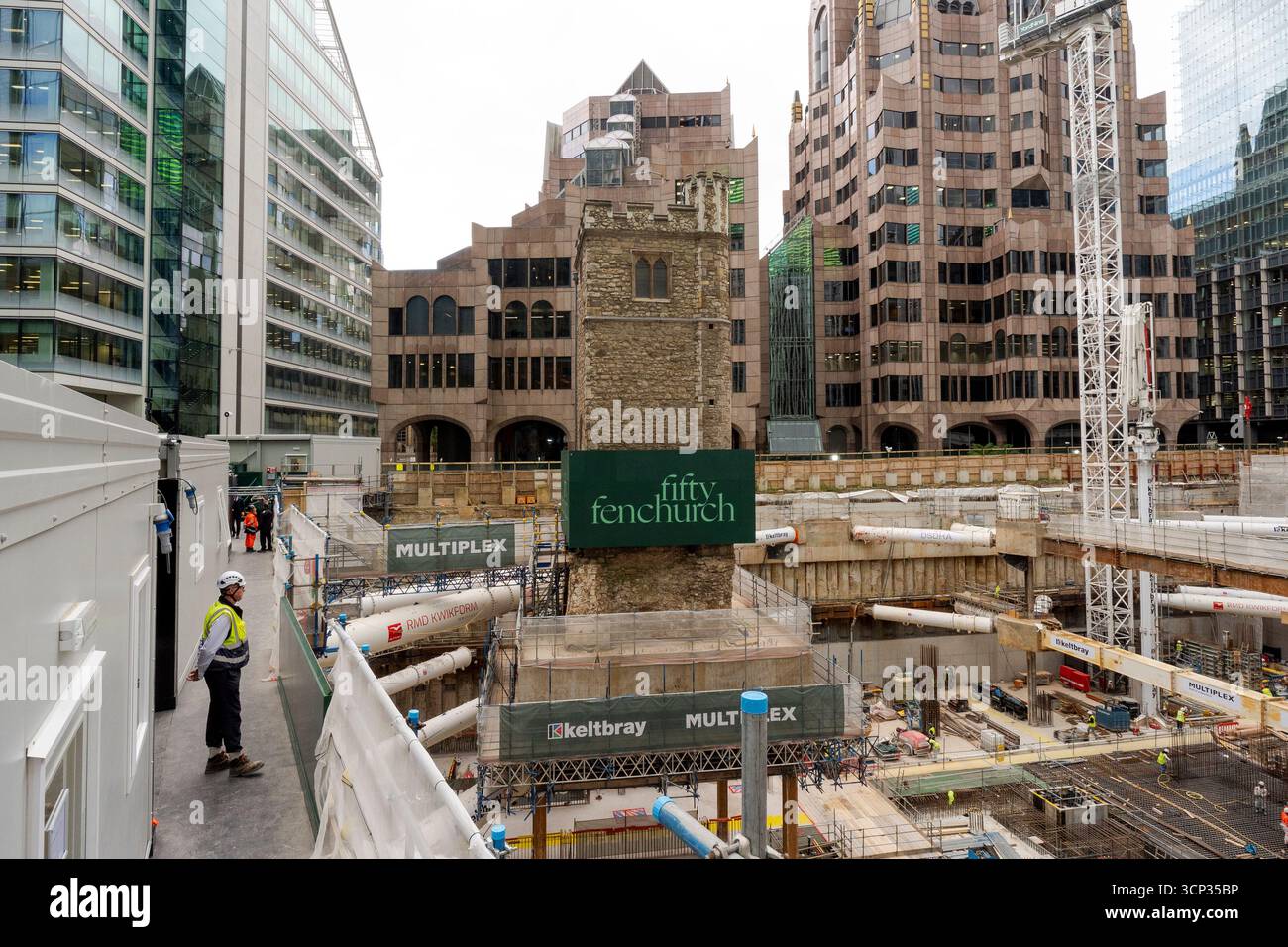 People look out to the 700-year-old tower of All Hallows Staining ...