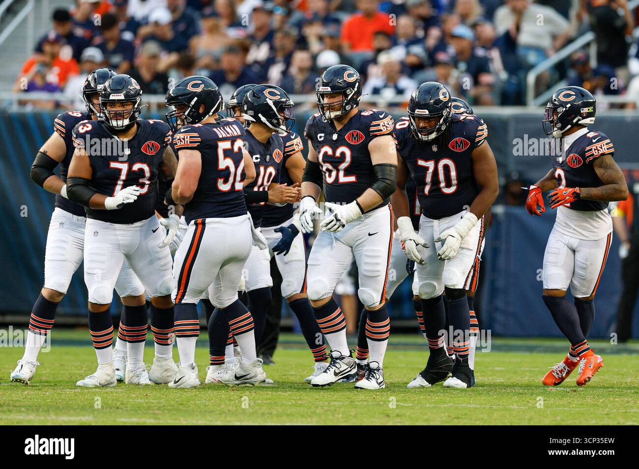 Chicago Bears players walk on the field during the second half of an ...