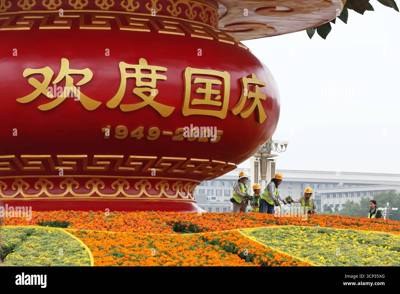 Beijing,China.23th September 2025. People take photos of a giant flower ...