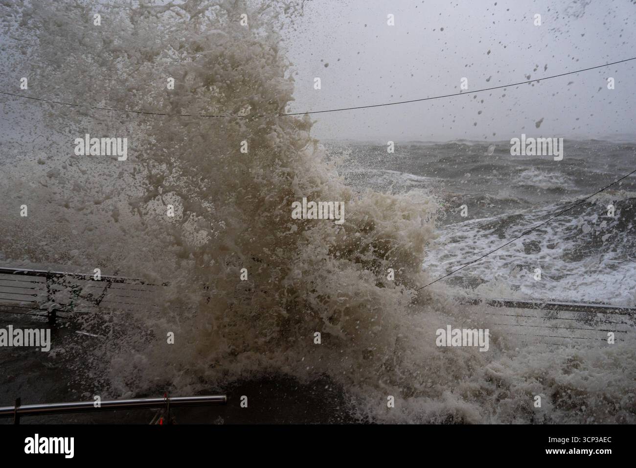 Hong Kong During Typhoon Ragasa Waves splashing onto a promenade ...
