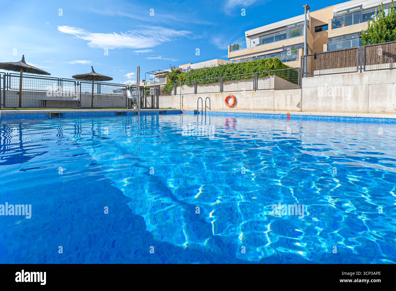 Community pool with an integrated architectural design that appears to ...