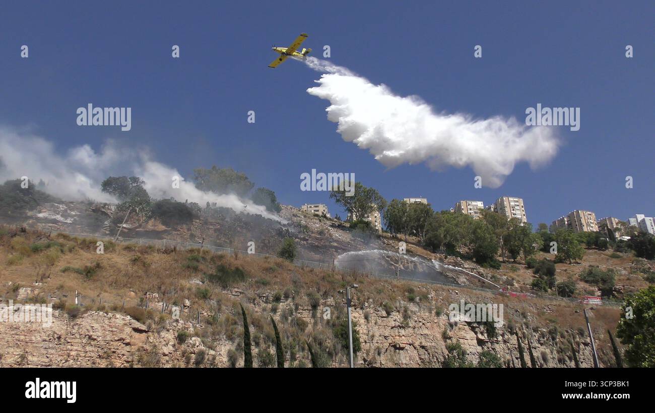 Firefighting aircrafts were deployed to spray fire-retardant chemicals ...