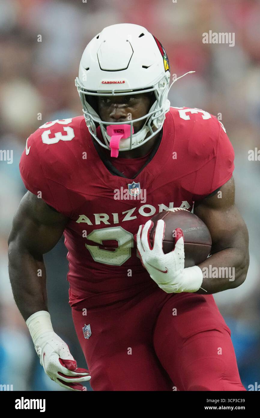 Arizona Cardinals running back Trey Benson runs with the ball against ...