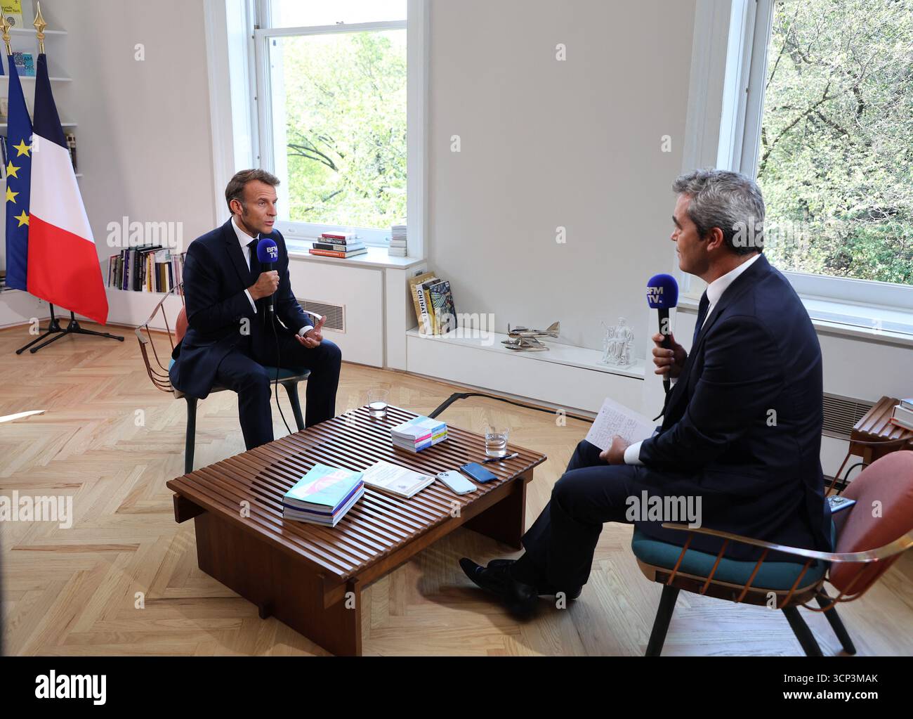 President of France Emmanuel Macron is talking to French TV host ...