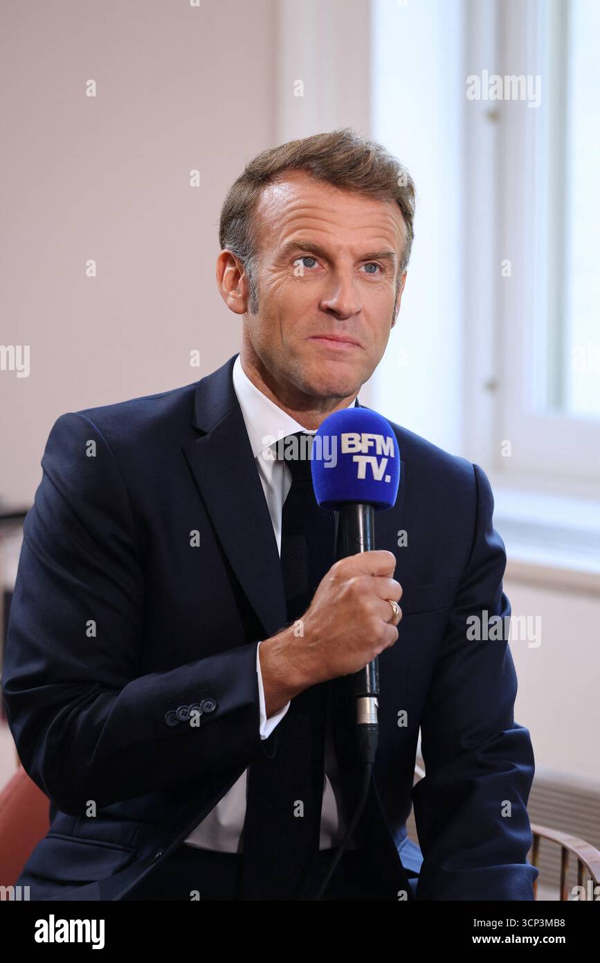 President of France Emmanuel Macron is talking to French TV host ...
