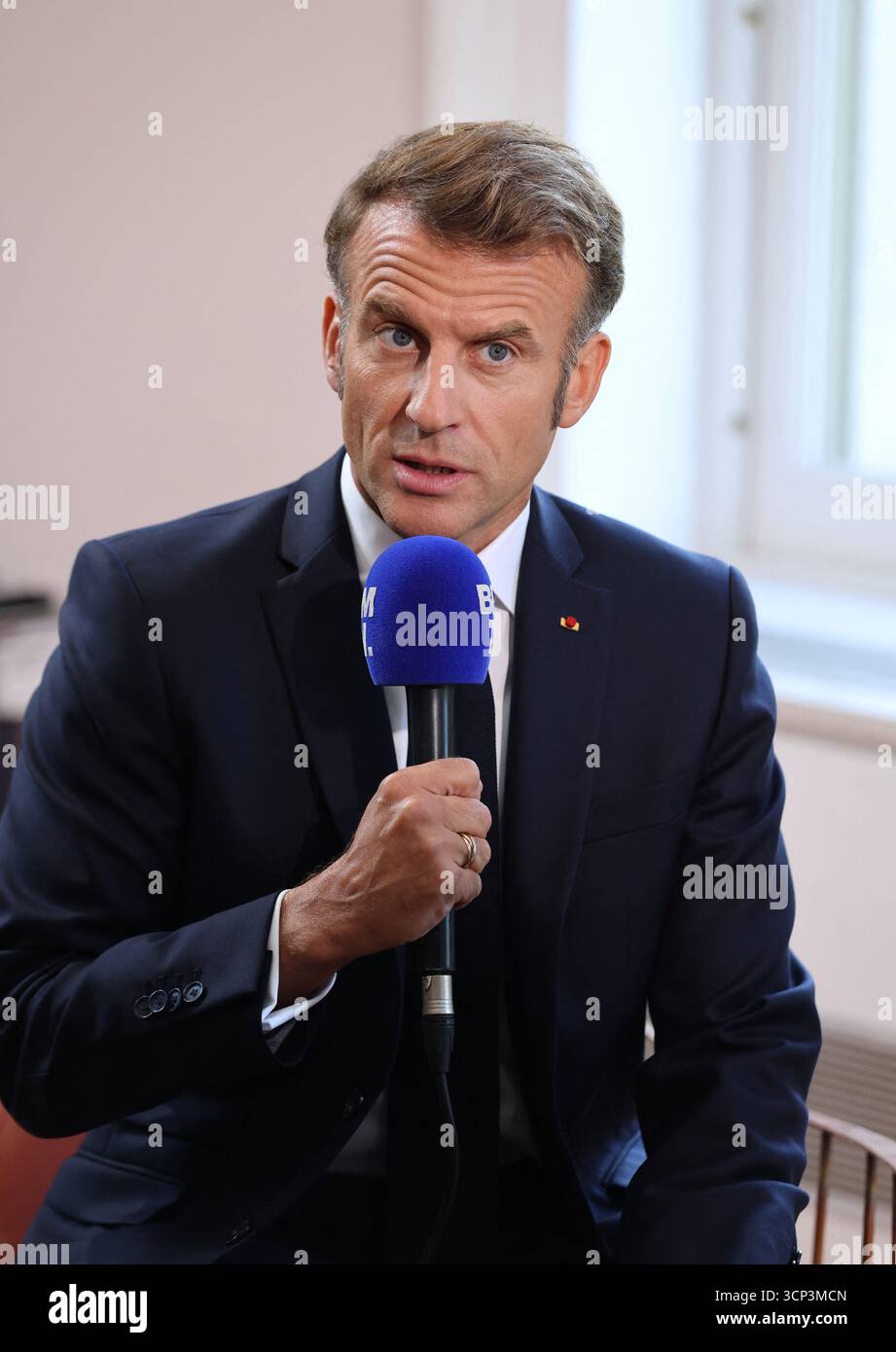 President of France Emmanuel Macron is talking to French TV host ...