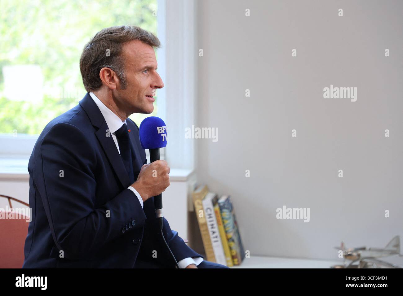 President of France Emmanuel Macron is talking to French TV host ...