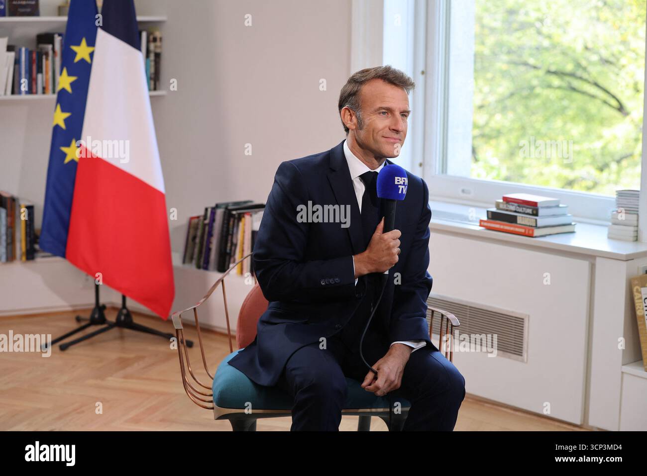 President of France Emmanuel Macron is talking to French TV host ...