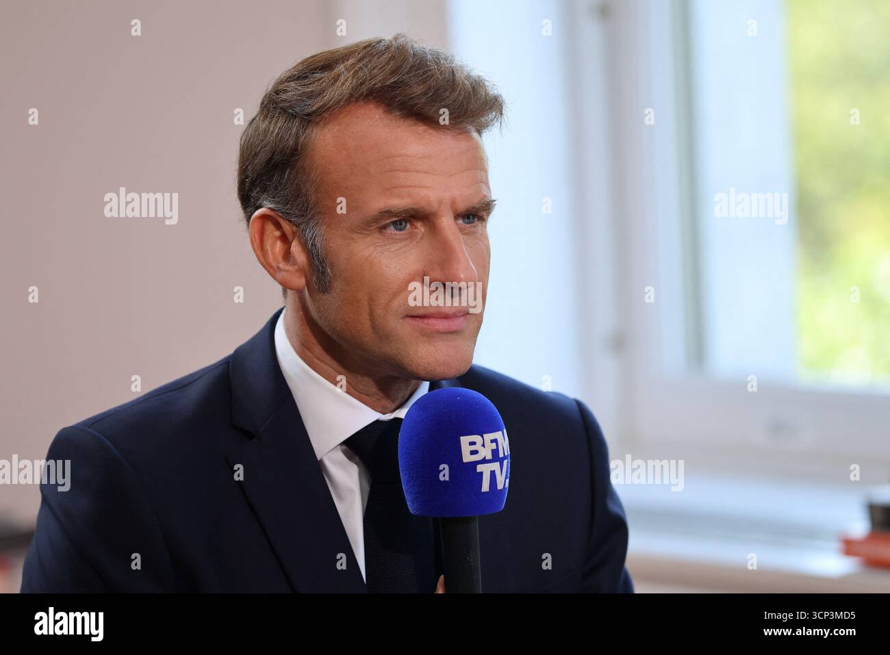 President of France Emmanuel Macron is talking to French TV host ...