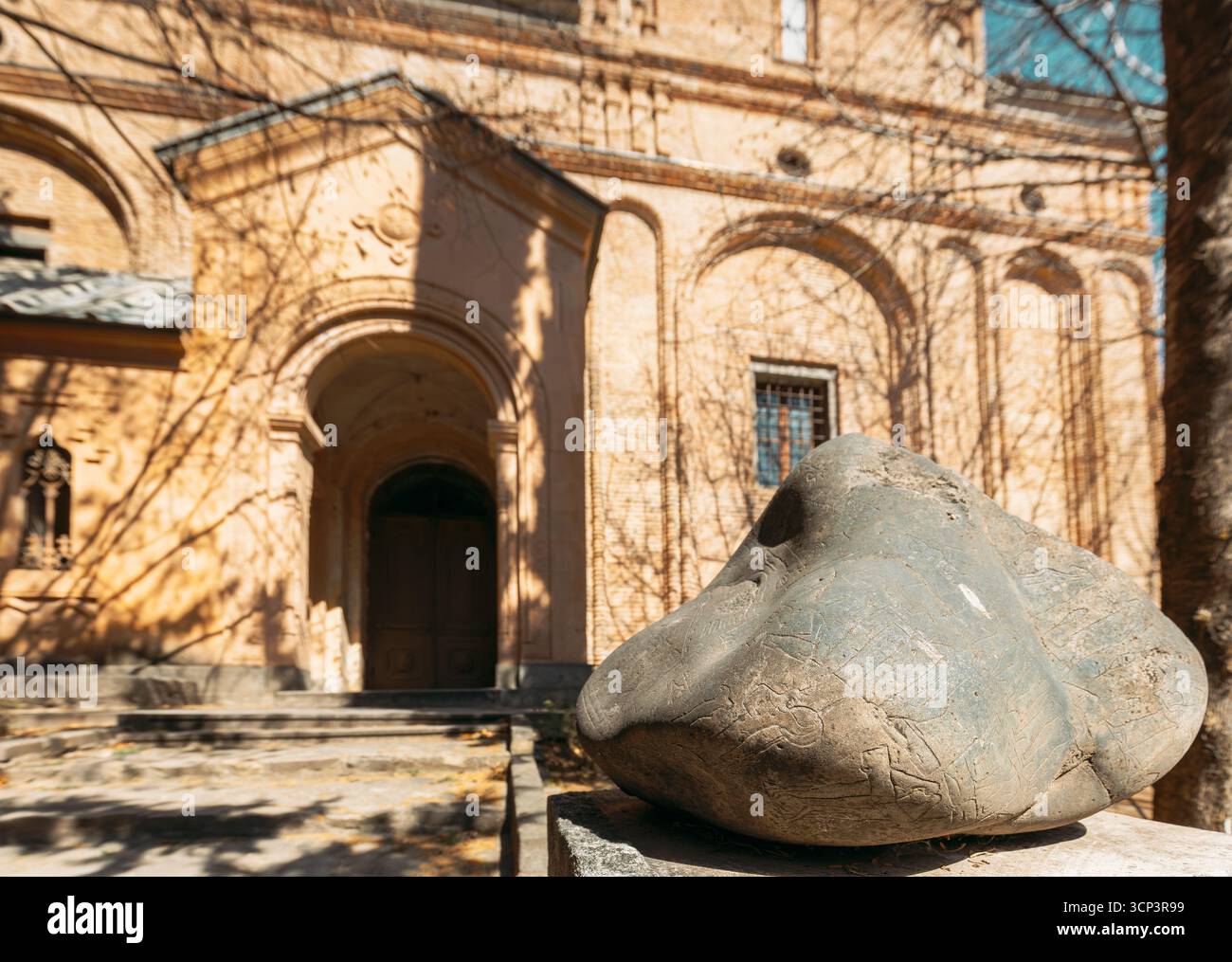 Tbilisi, Georgia. Ancient stone with carved figures near St. Virgin ...