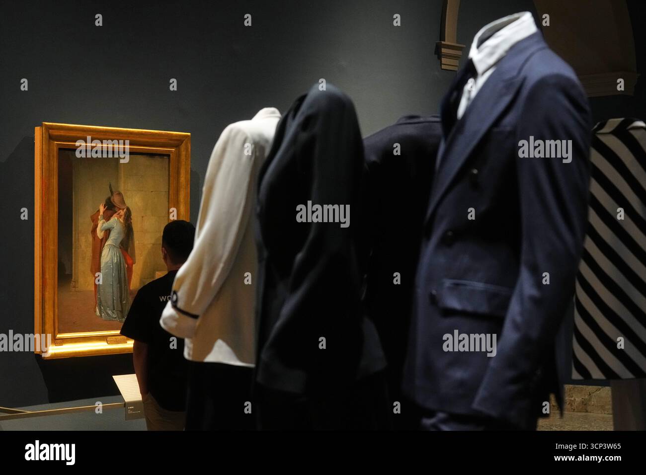Giorgio Armani's creations are backdropped by the painting by Francesco ...
