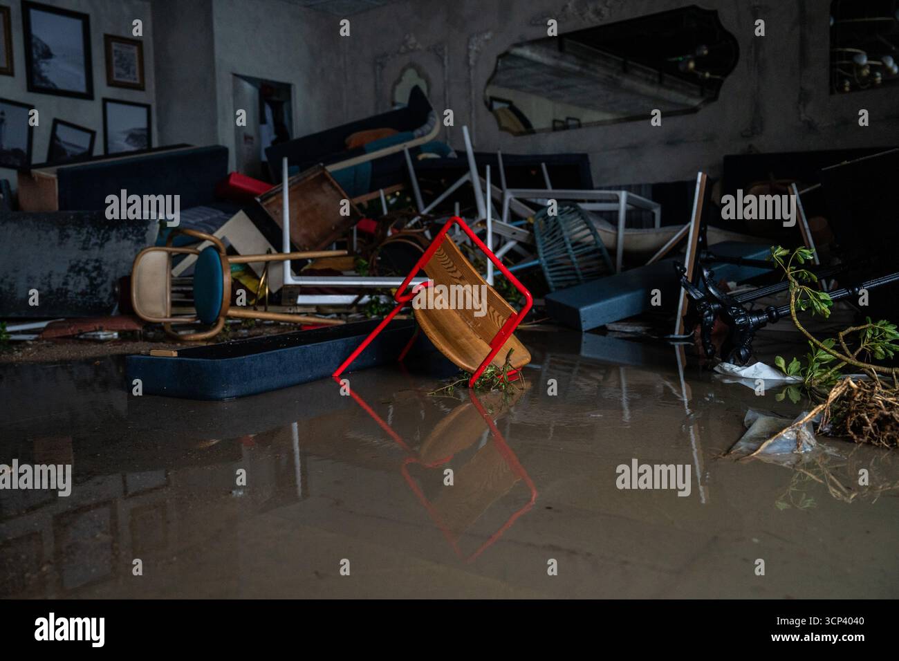 The inside of a restaurant damaged by sea water at Tseung Kwan O ...
