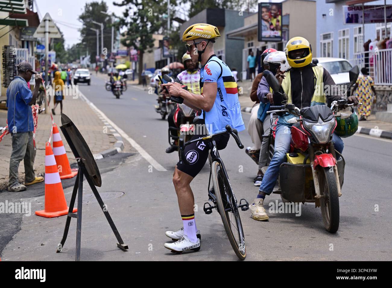 Belgian Remco Evenepoel looks on his phone during a break at a training ...