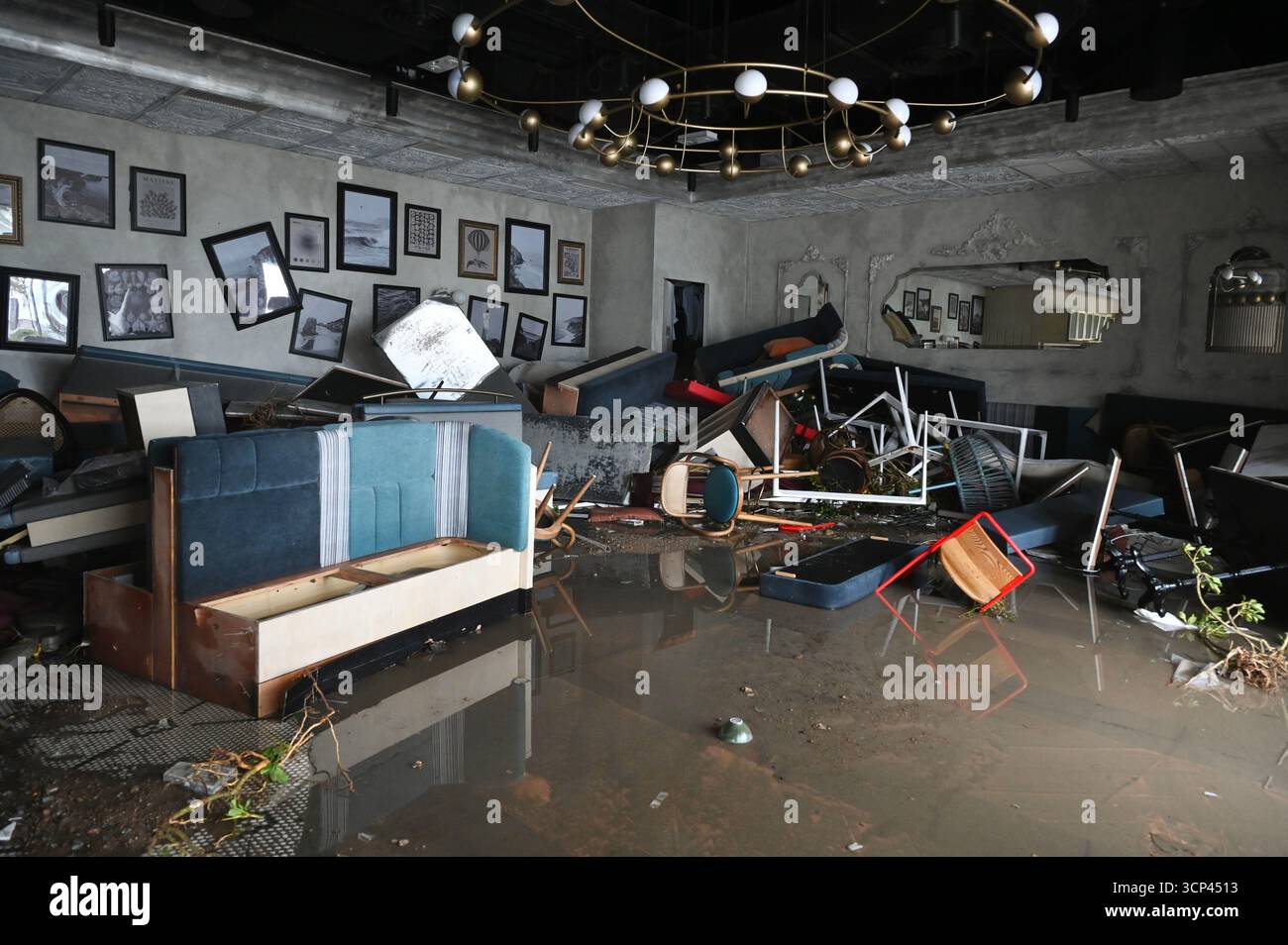 The inside of a restaurant damaged by sea water at Tseung Kwan O ...