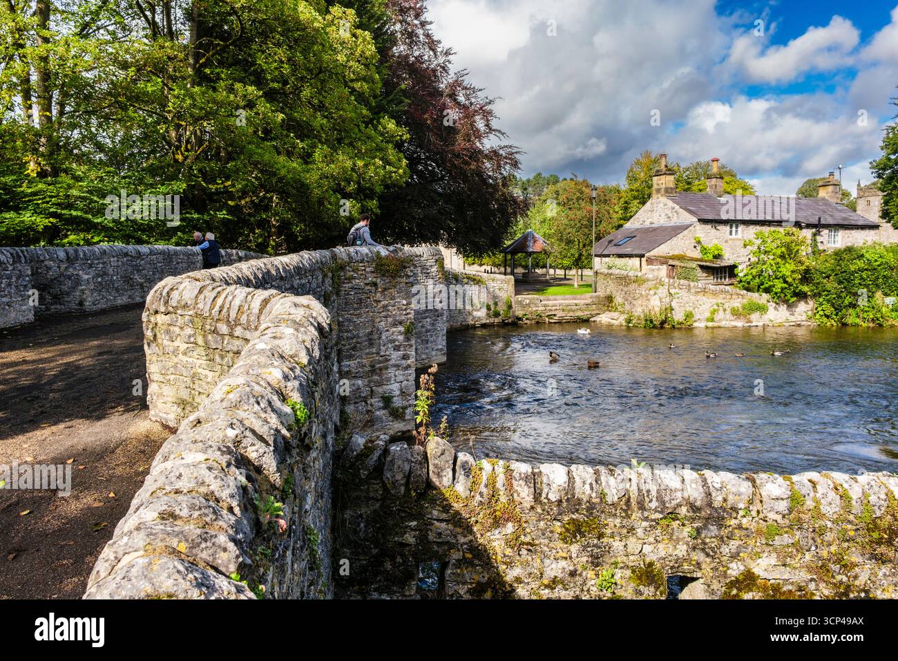 17th century Sheepwash Bridge over River Wye in Peak District National ...