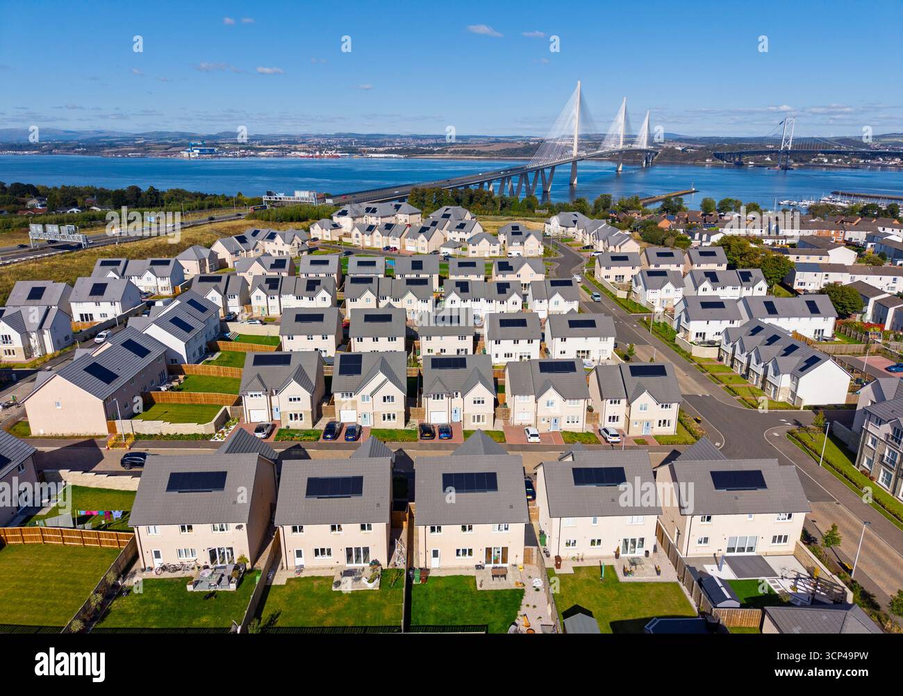 Aerial view from drone of houses with solar panels on roof in new ...