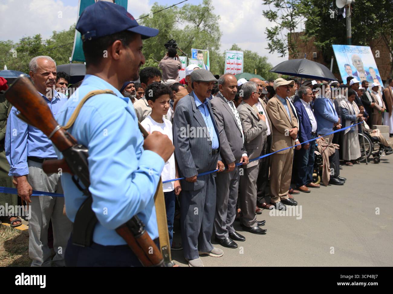 Pro-Palestinian rally in Sana a Houthi security personal stands guard ...