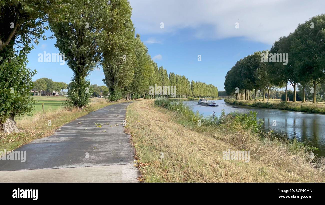 Tournai Belgium September 2025. Trees line the River Scheldt with a ...