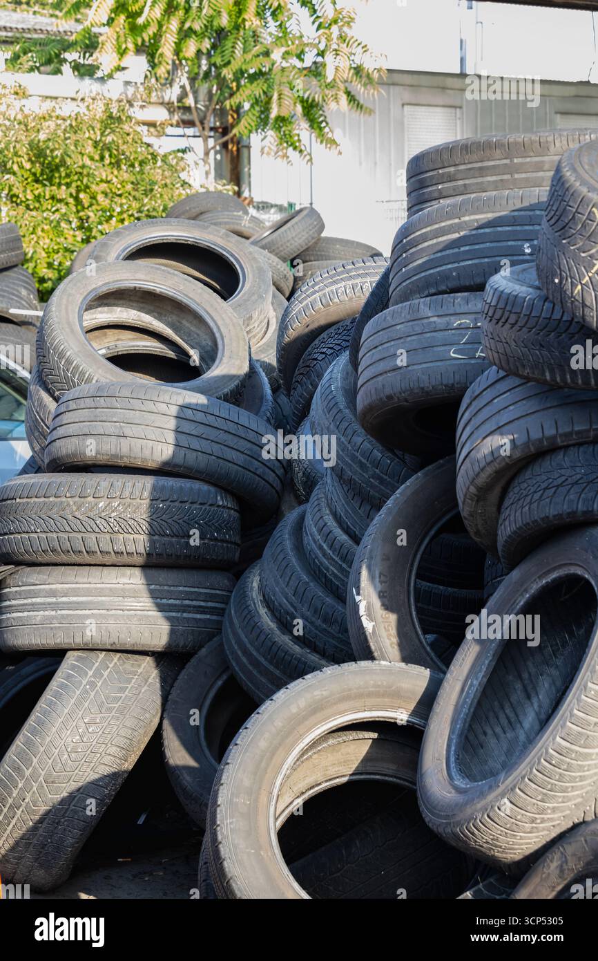 pile of used tires stacked outdoors Stock Photo - Alamy
