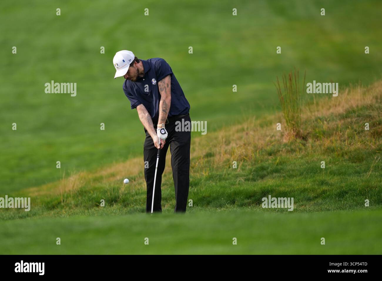 Europe's Brooklyn Peltz Beckham hits from the rough on the fifth hole ...