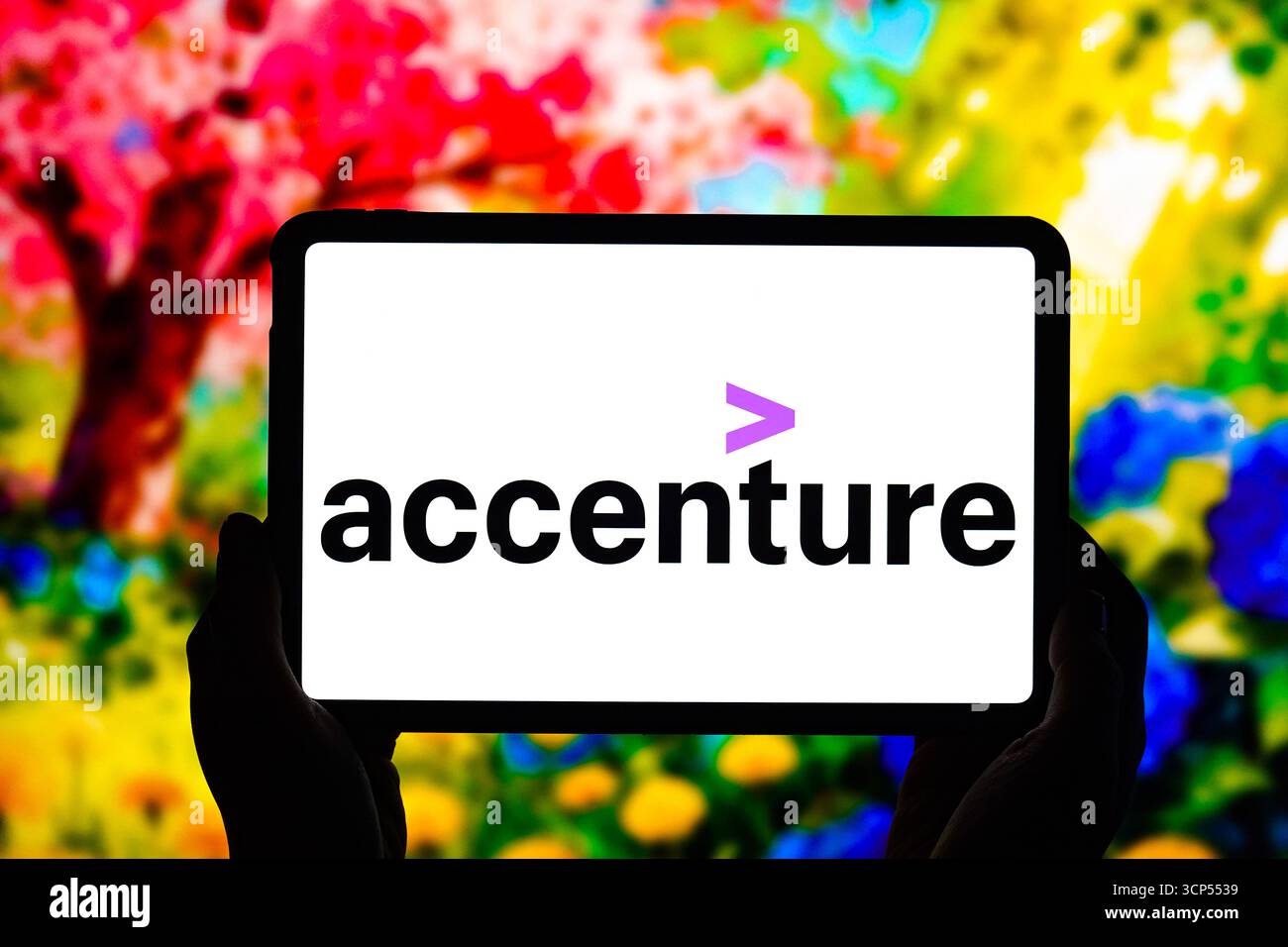 In this photo illustration, Accenture's logo is displayed on the screen ...