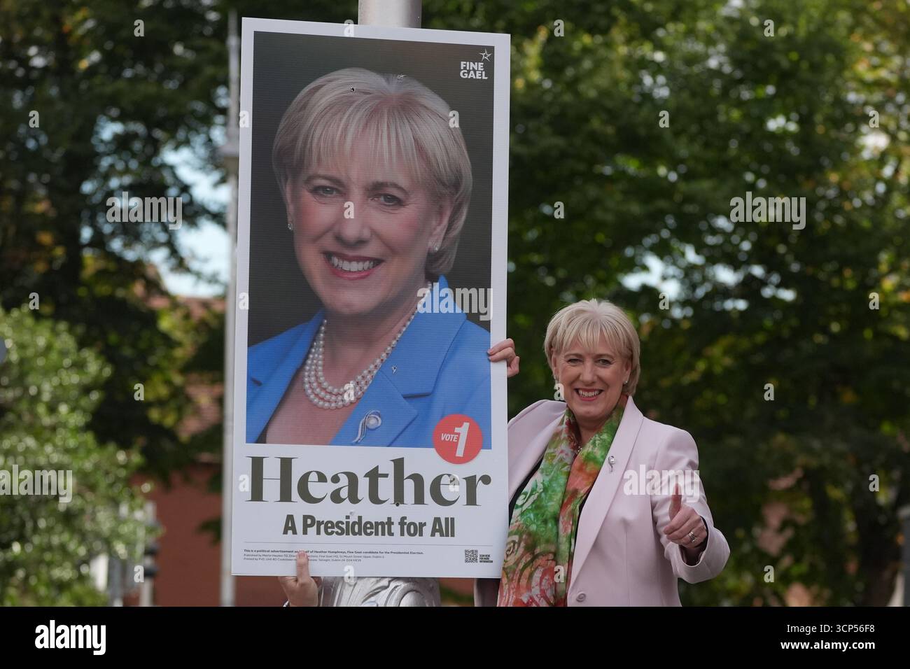 Fine Gael presidential candidate Heather Humphreys, hangs a campaign ...
