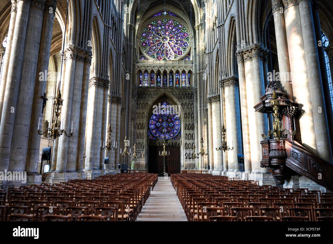 Reims Cathedral nave with stained glass rose window and pulpit Stock ...