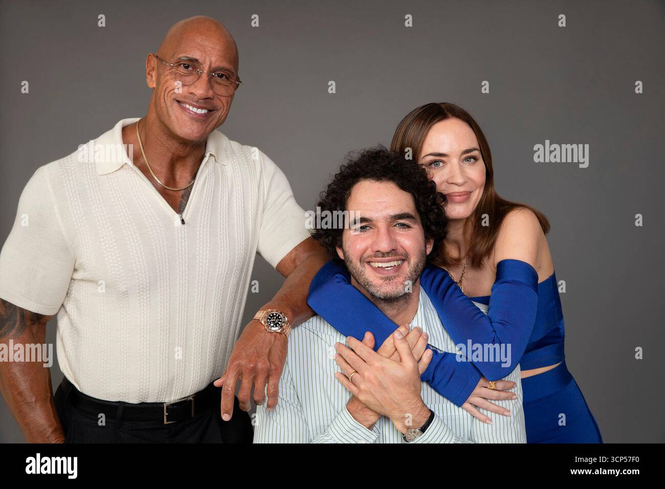 Dwayne Johnson, from left, Benny Safdie and Emily Blunt pose to promote ...