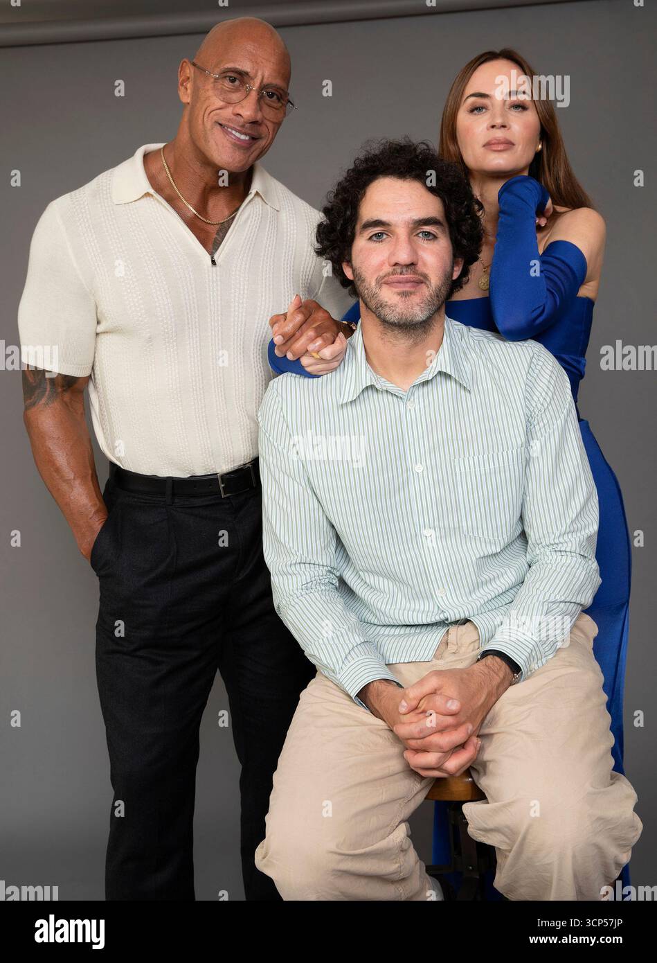 Dwayne Johnson, from left, Benny Safdie and Emily Blunt pose to promote ...