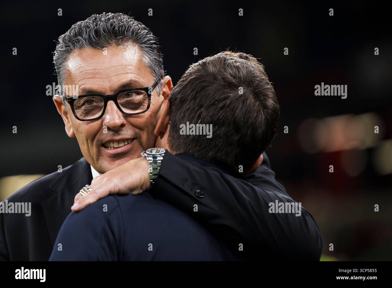 Marco Landucci, assistant coach of AC Milan, hugs Eusebio Di Francesco ...
