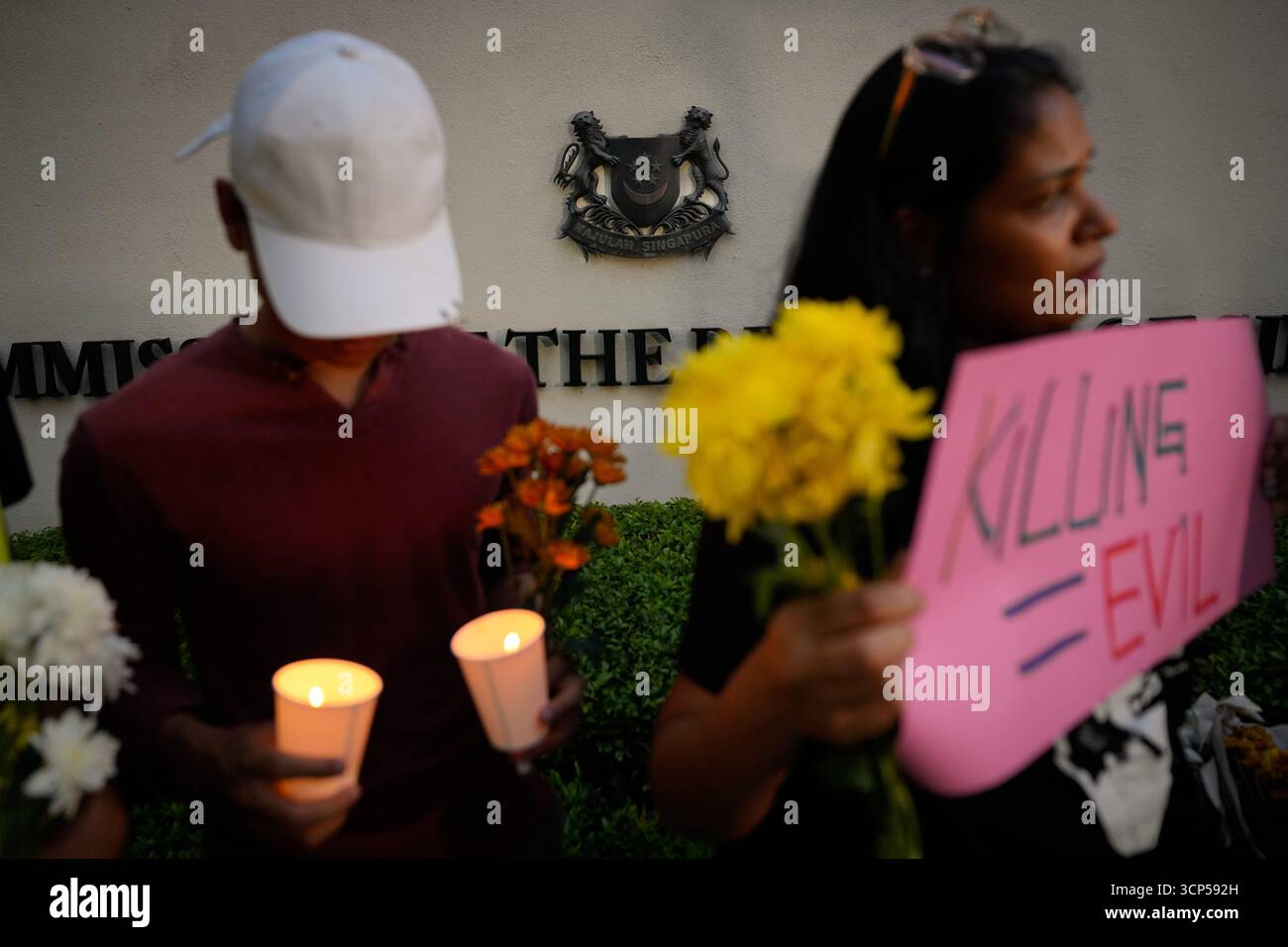 Anti-death penalty activists hold candles during a protest against the ...
