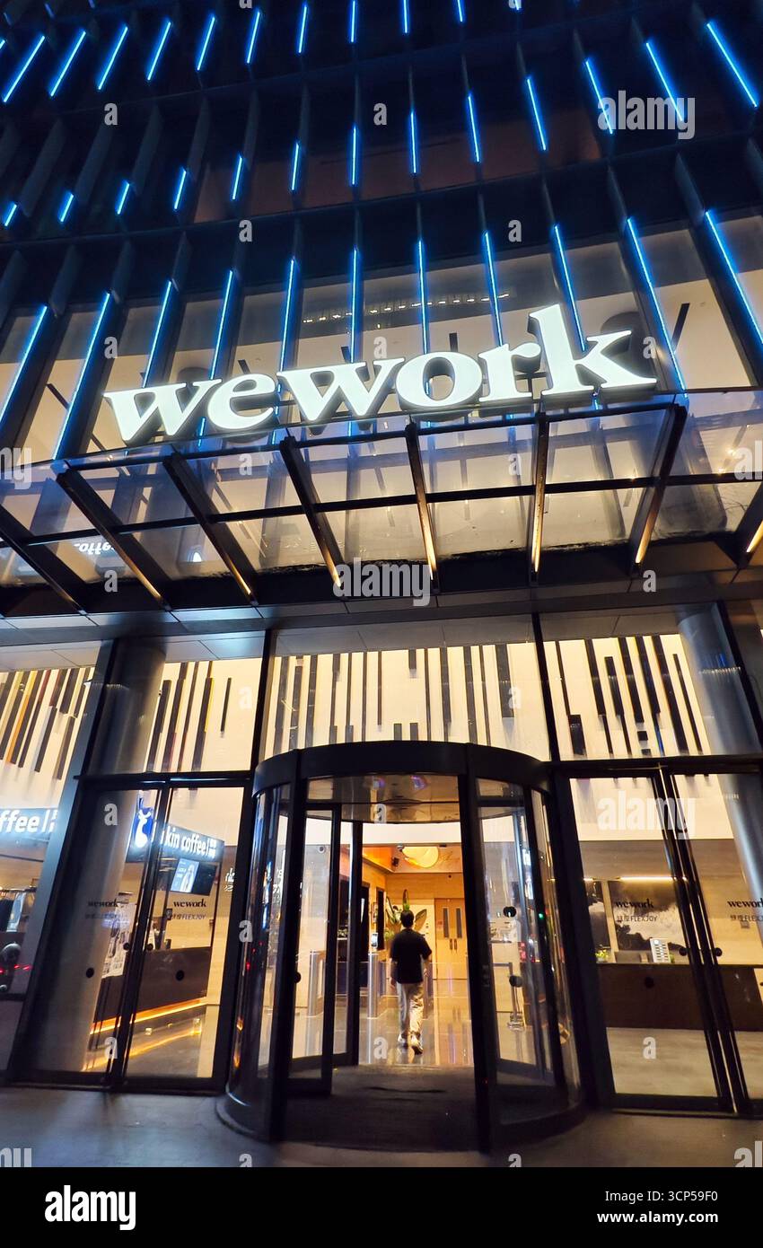 The company logo of WeWork, the leader of shared-office provider, on ...