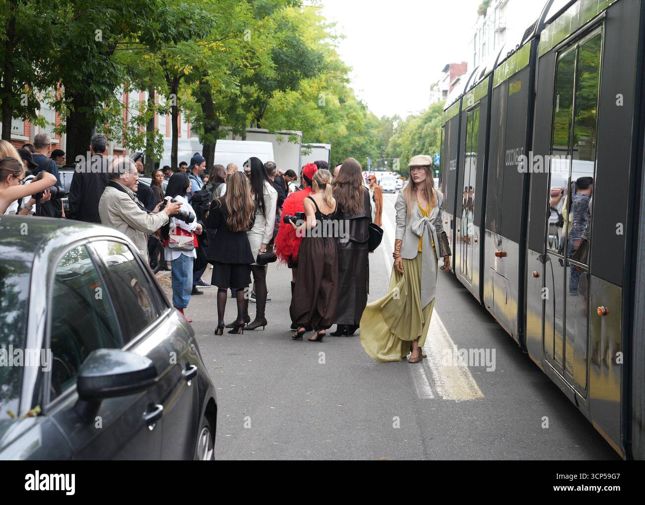 Milan, Crowds of people, influencers, and onlookers outside the Fendi ...