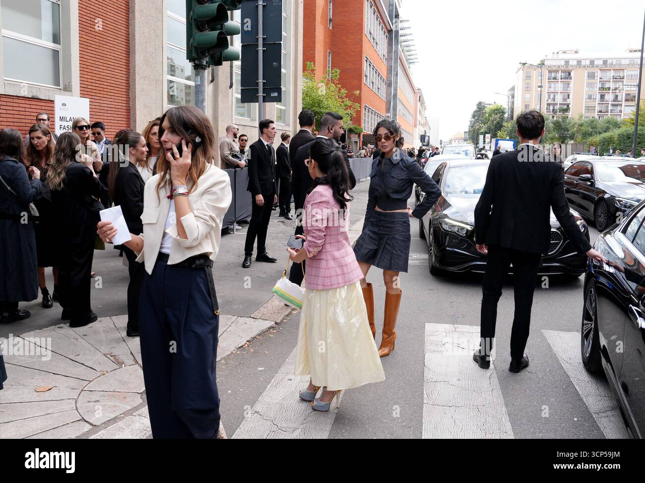 Milan, Crowds of people, influencers, and onlookers outside the Fendi ...