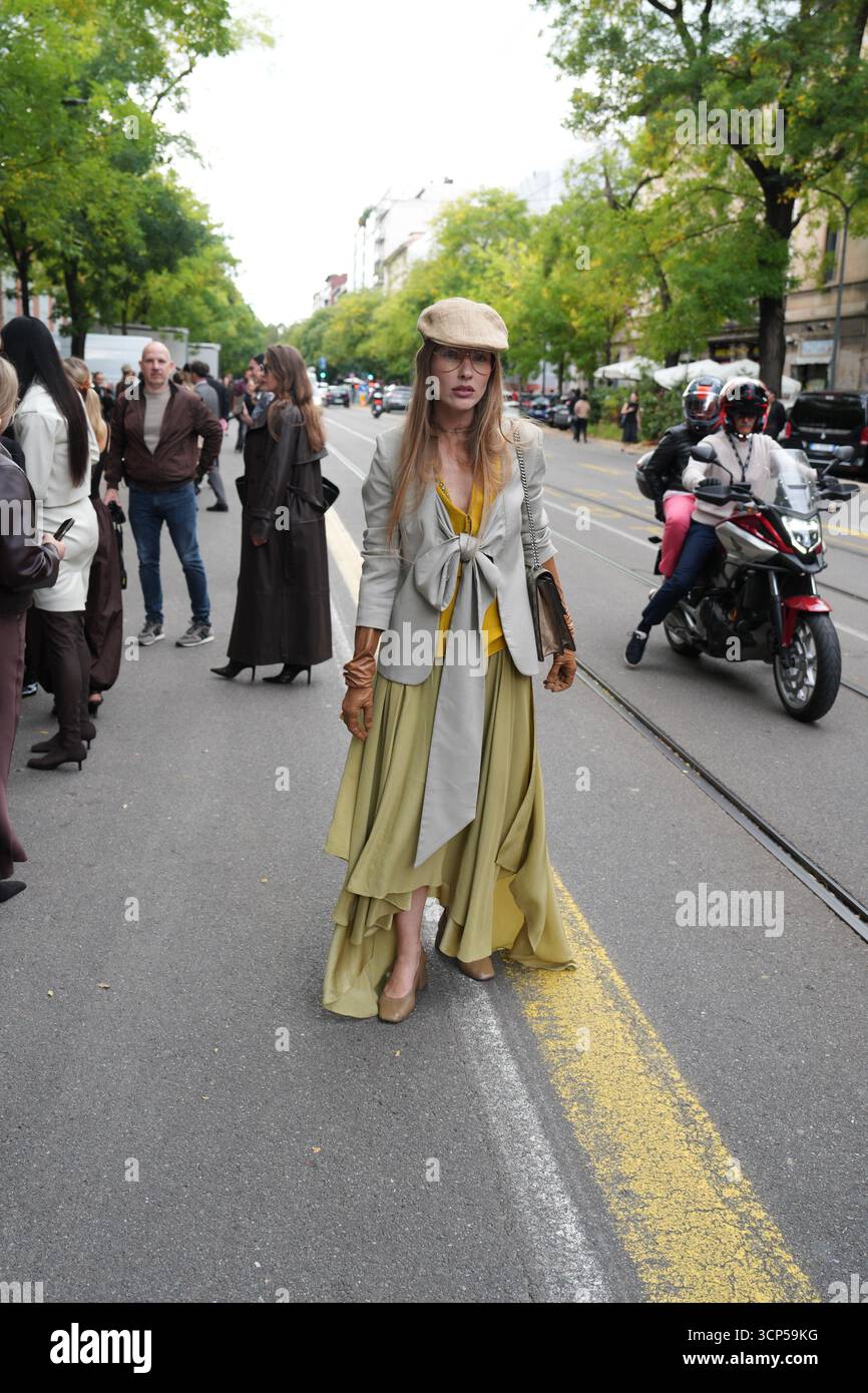 Milan, Crowds of people, influencers, and onlookers outside the Fendi ...