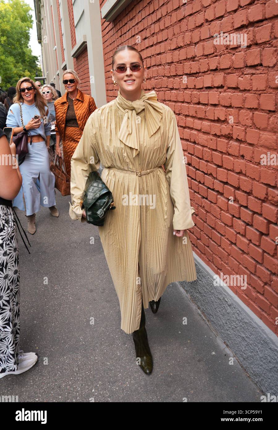 Milan, Crowds of people, influencers, and onlookers outside the Fendi ...