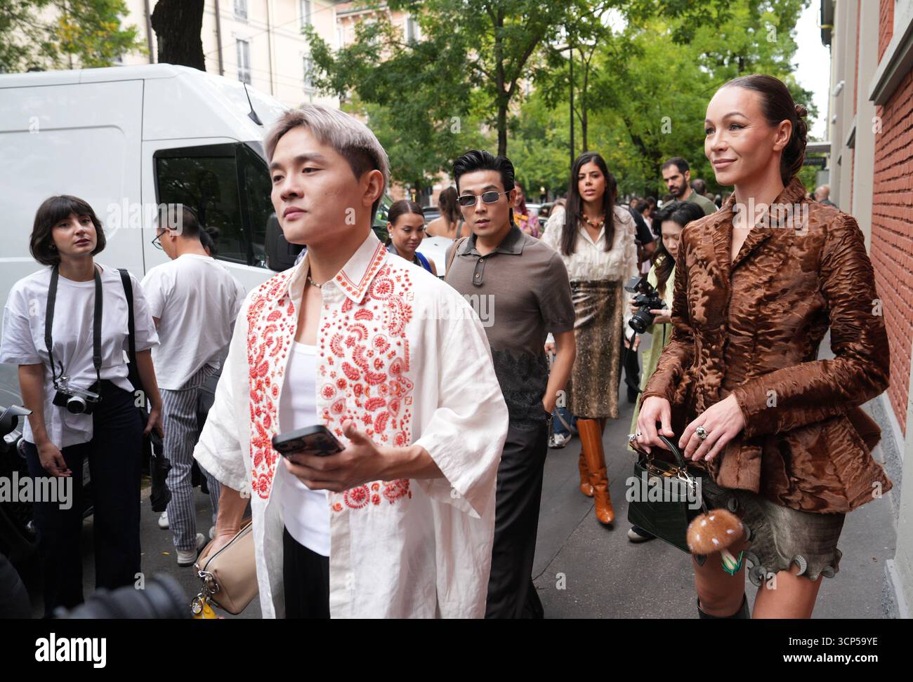 Milan, Crowds of people, influencers, and onlookers outside the Fendi ...