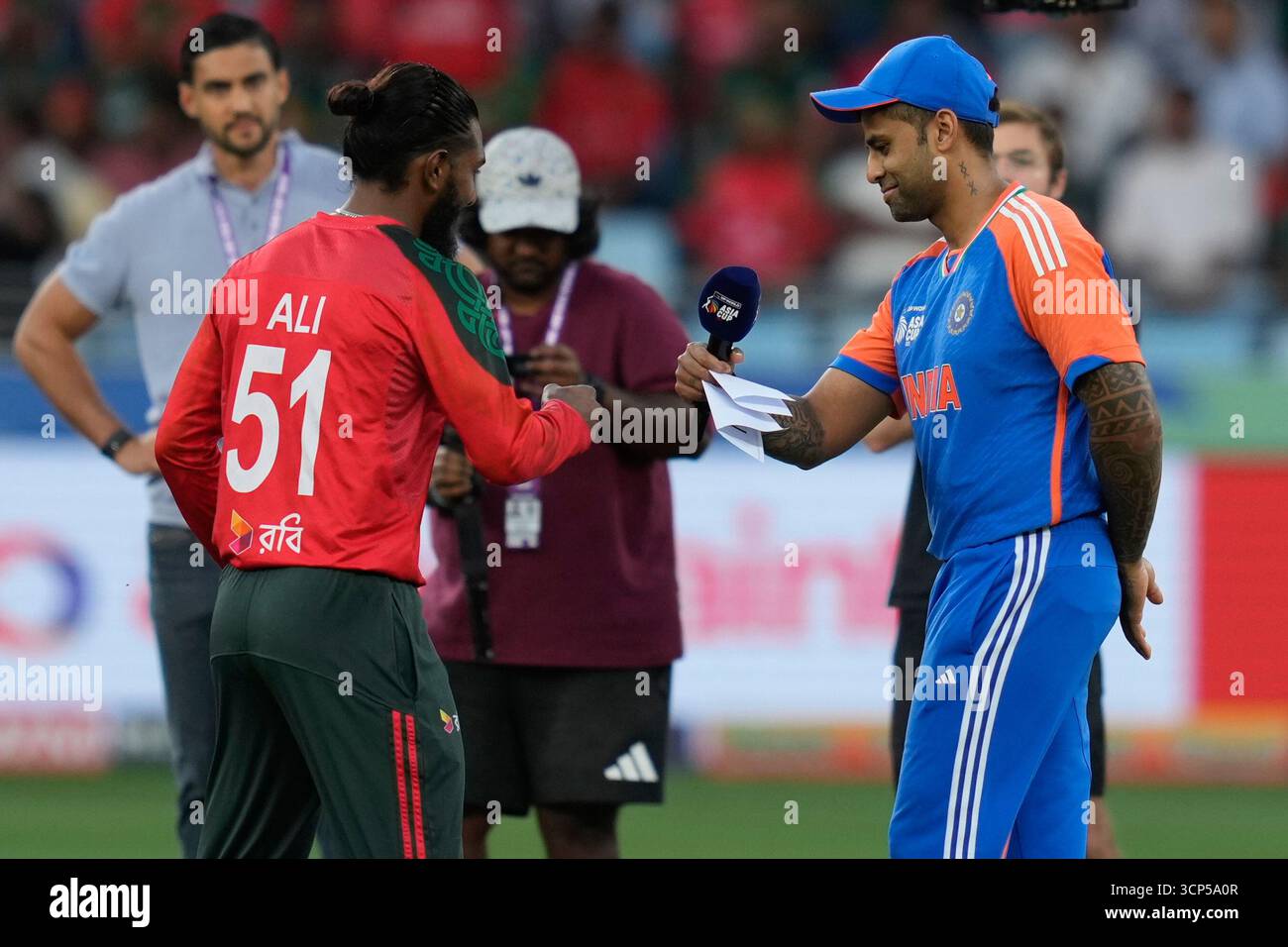 India's captain Suryakumar Yadav, right, and Bangladesh's captain Jaker Ali after the toss ...