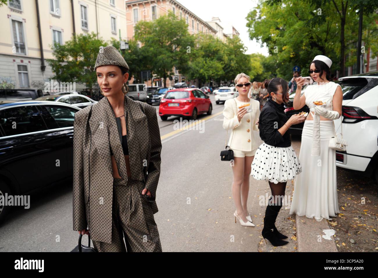 Milan, Crowds of people, influencers, and onlookers outside the Fendi ...