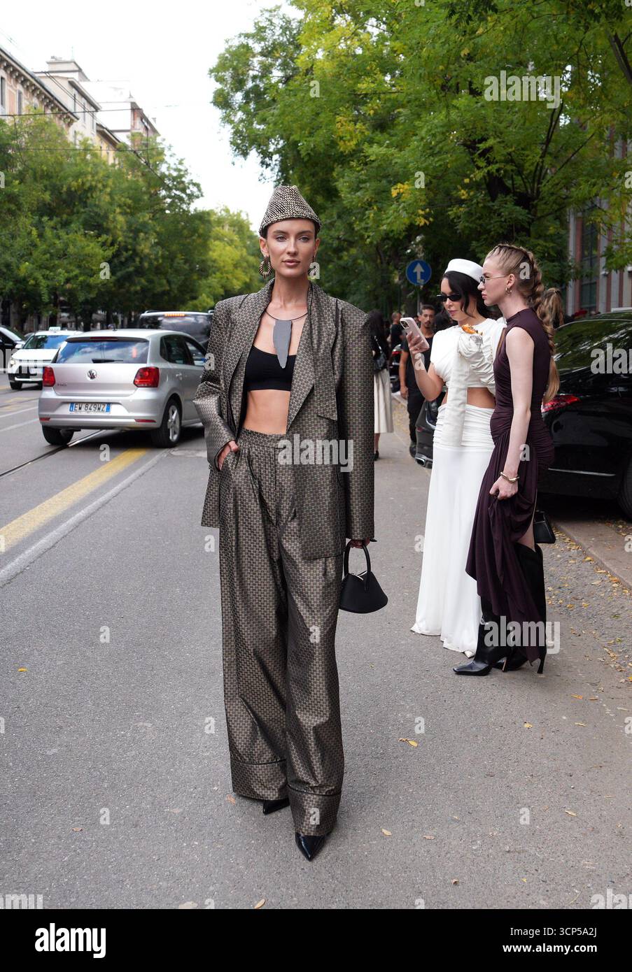 Milan, Crowds of people, influencers, and onlookers outside the Fendi ...