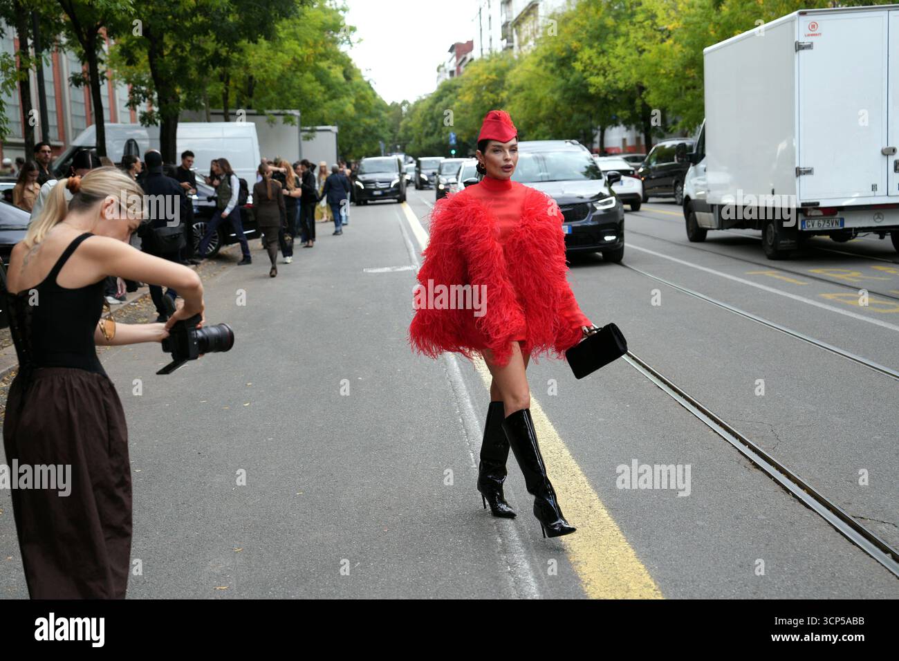 Milan, Crowds of people, influencers, and onlookers outside the Fendi ...