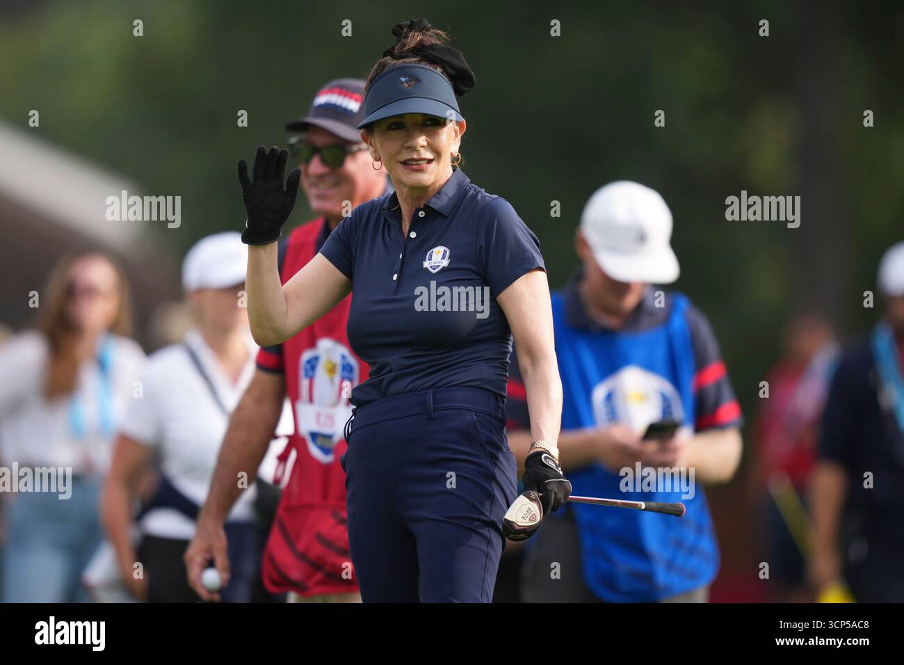 Europe's Catherine Zeta-Jones waves on the third hole during the ...