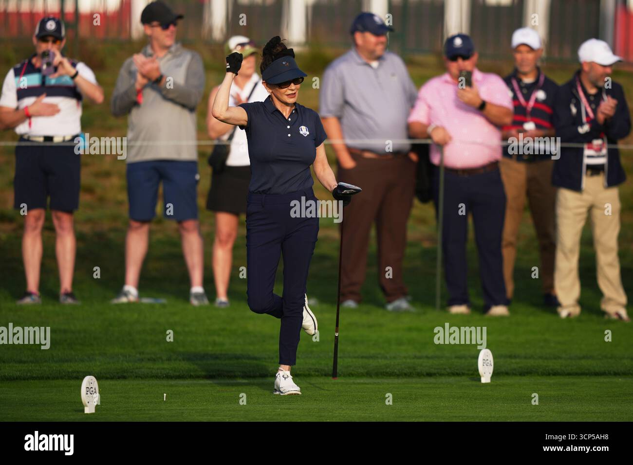 Europe's Catherine Zeta-Jones watches her tee shot on the first hole ...
