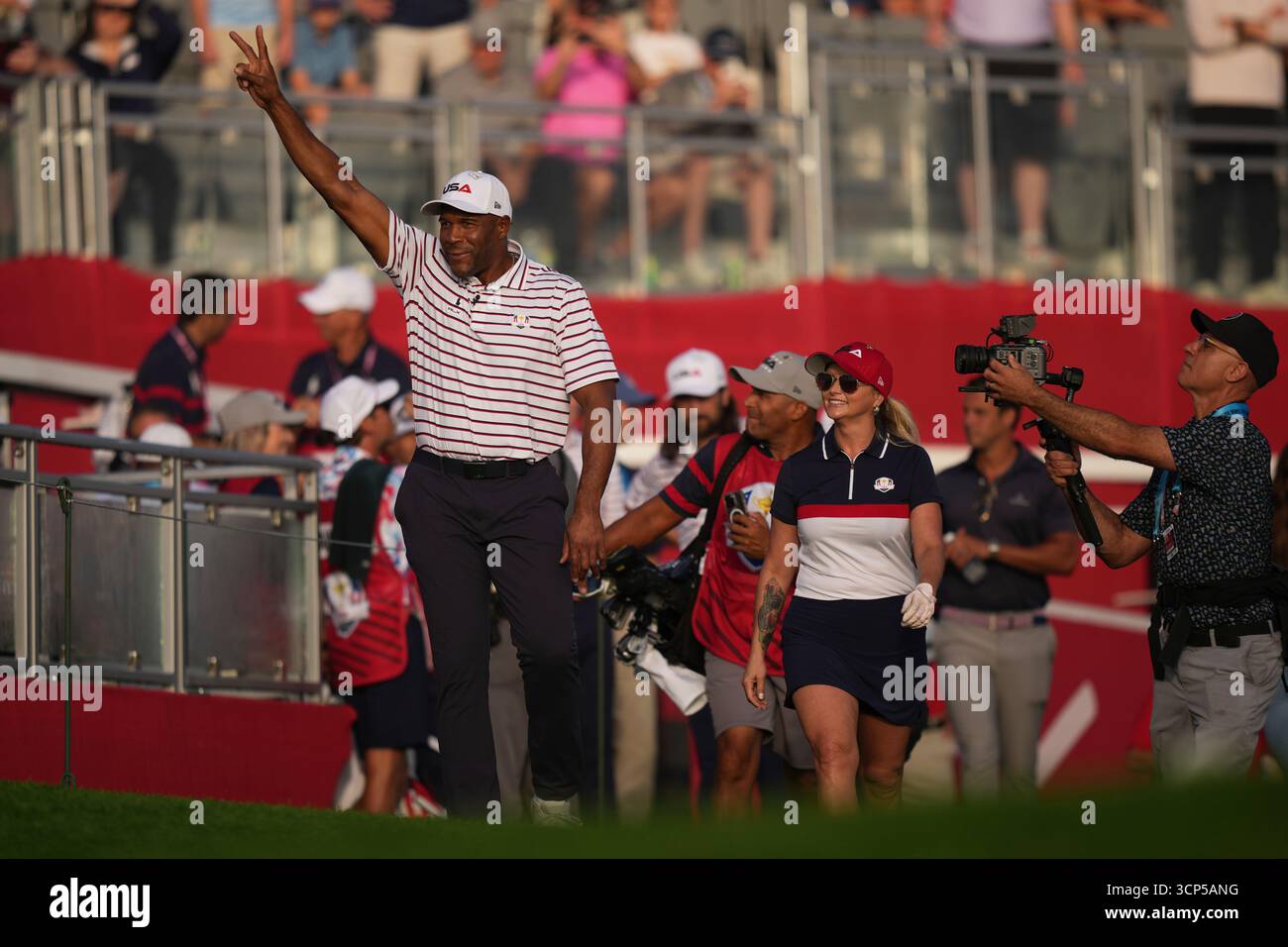 United States' Miranda Lambert and Michael Strahan get ready to play on ...